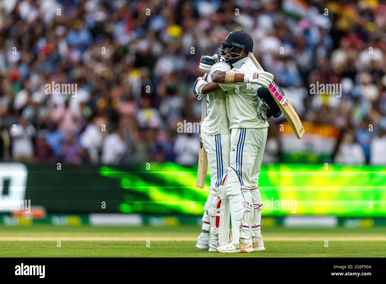 MELBOURNE, AUSTRALIA - DECEMBER 28: Nitish Kumar Reddy is hugged by his ...