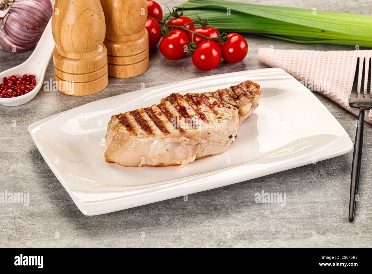 Grilled fat pork loin steak with bone Stock Photo - Alamy