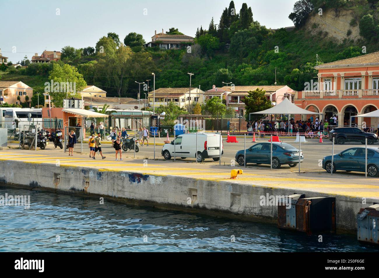 Corfu, Greece - June 6th 2024. Passengers walk from the terminal ...