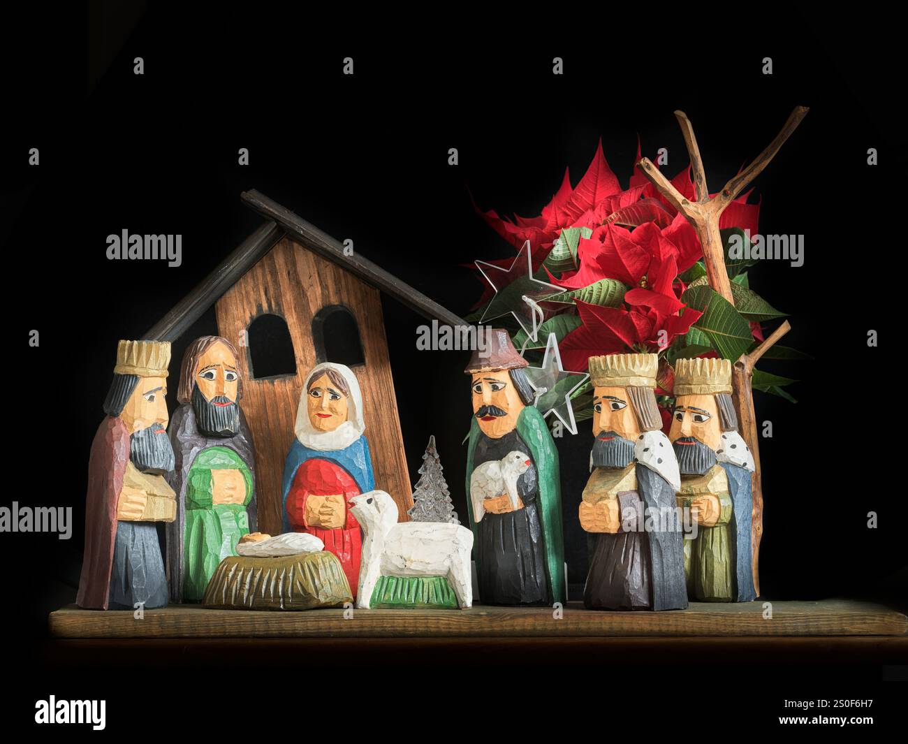 Hand painted wooden nativity figures, and stable, portraying the birth ...