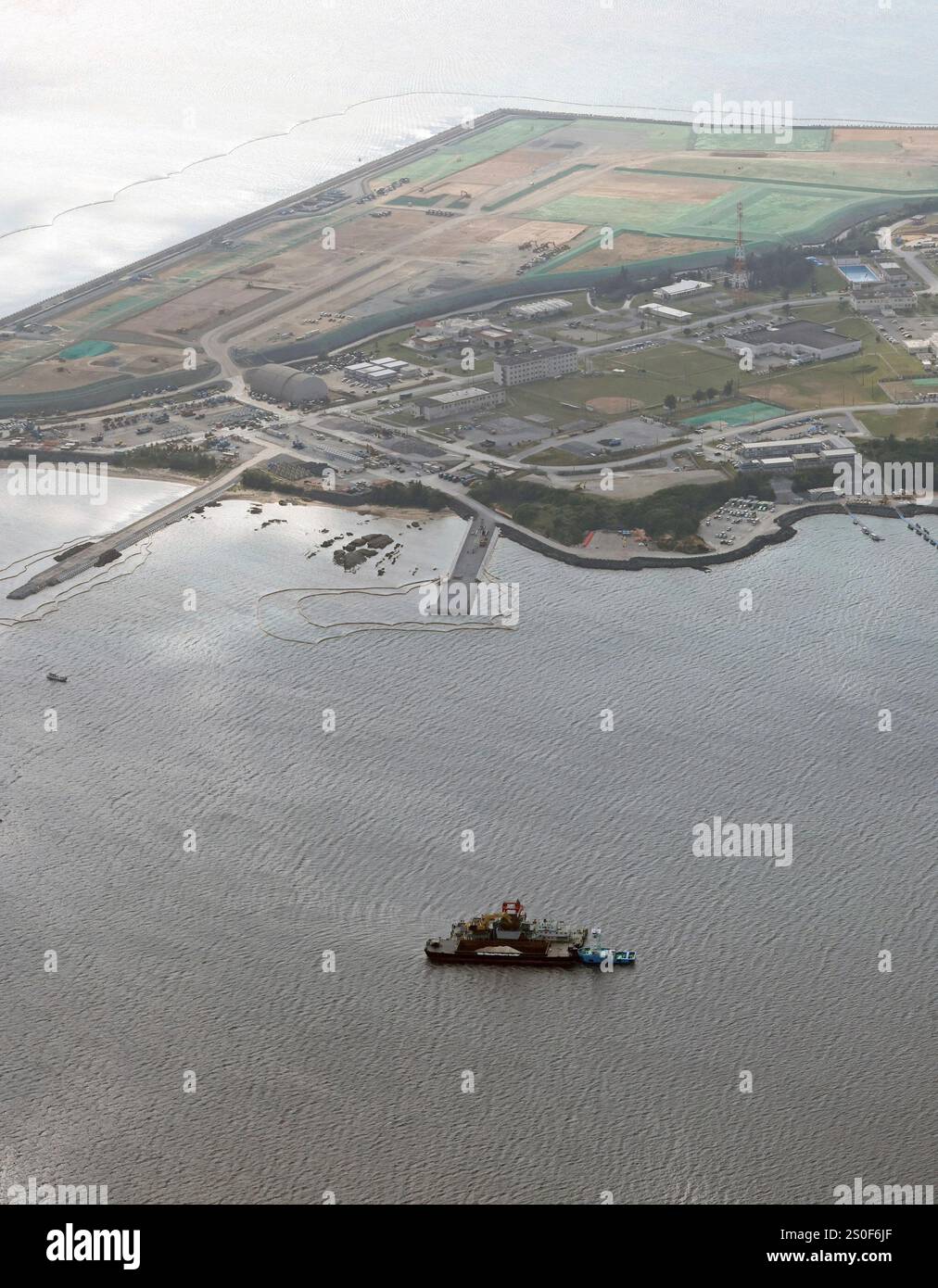 An aerial photo shows the work to improve the soft ground at Oura Bay ...