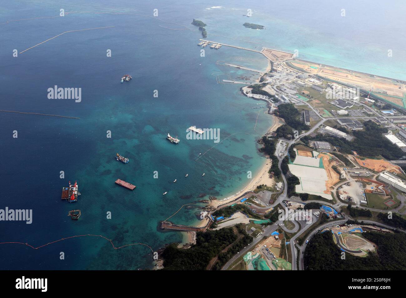 An aerial photo shows the work to improve the soft ground at Oura Bay ...