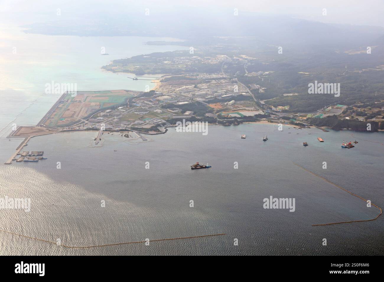 An aerial photo shows the work to improve the soft ground at Oura Bay ...