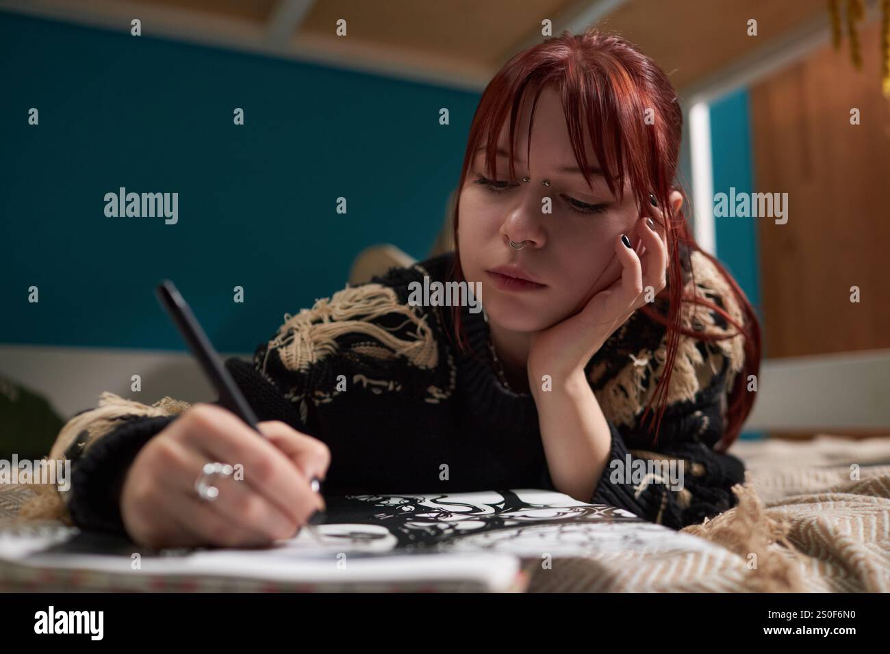 Relaxed Girl Drawing Picture With Marker Pen Stock Photo - Alamy