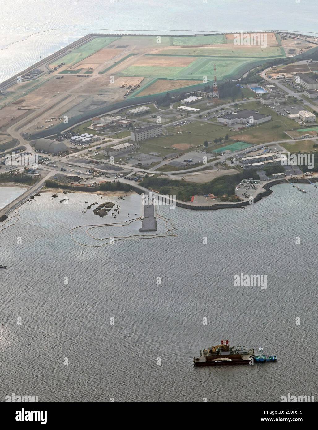 An aerial photo shows the work to improve the soft ground at Oura Bay ...