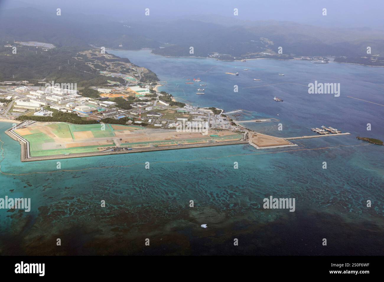 An aerial photo shows the work to improve the soft ground at Oura Bay ...