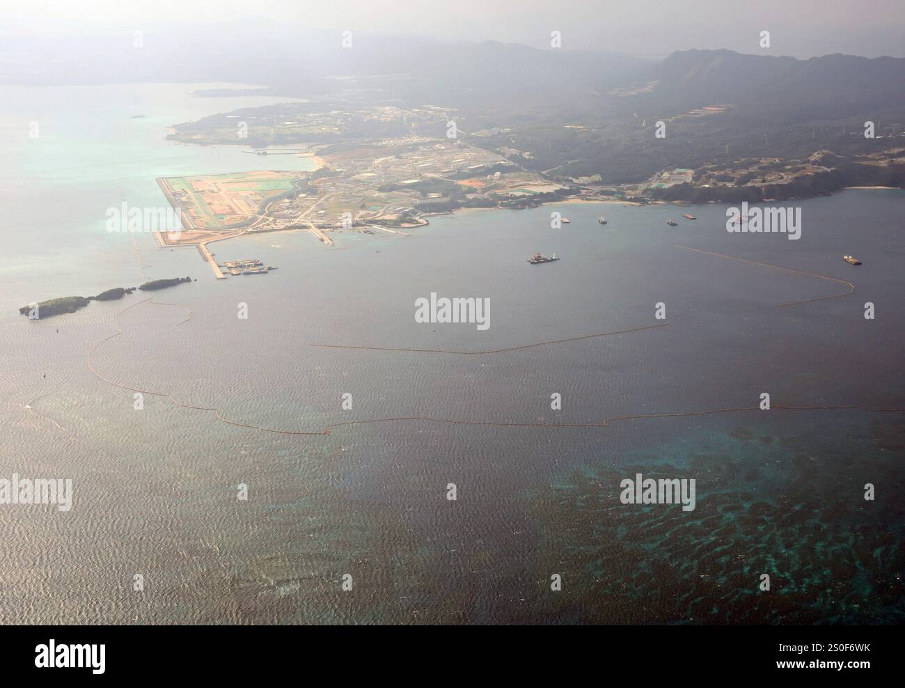 An aerial photo shows the work to improve the soft ground at Oura Bay ...