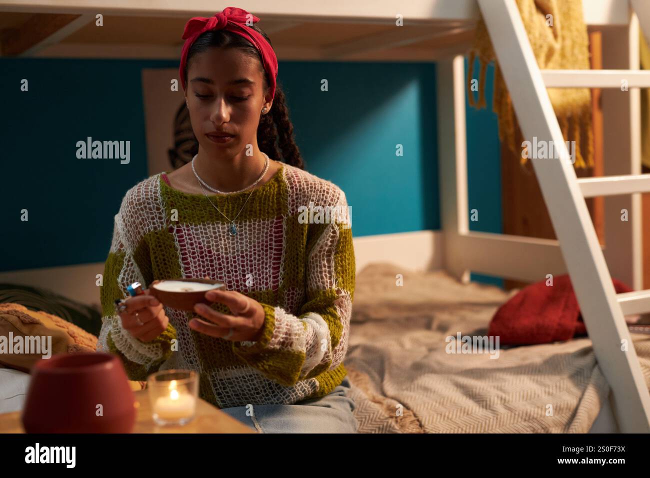 Gen Z Girl Lighting Up Candles In Dorm Room Stock Photo - Alamy