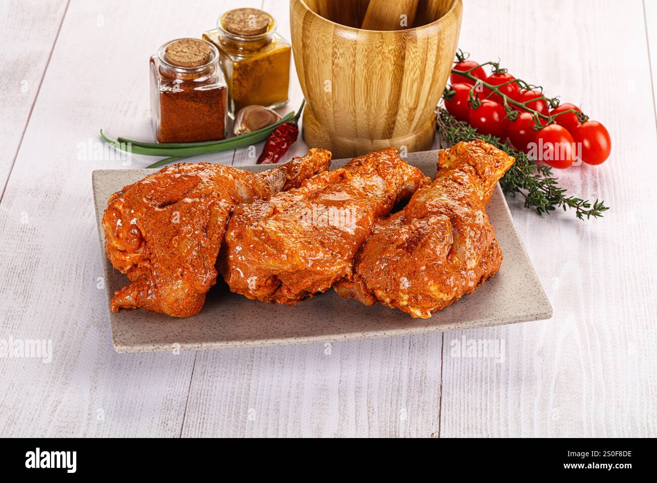 Raw turkey shoulder wing in Indian tandoori marinade spices Stock Photo ...