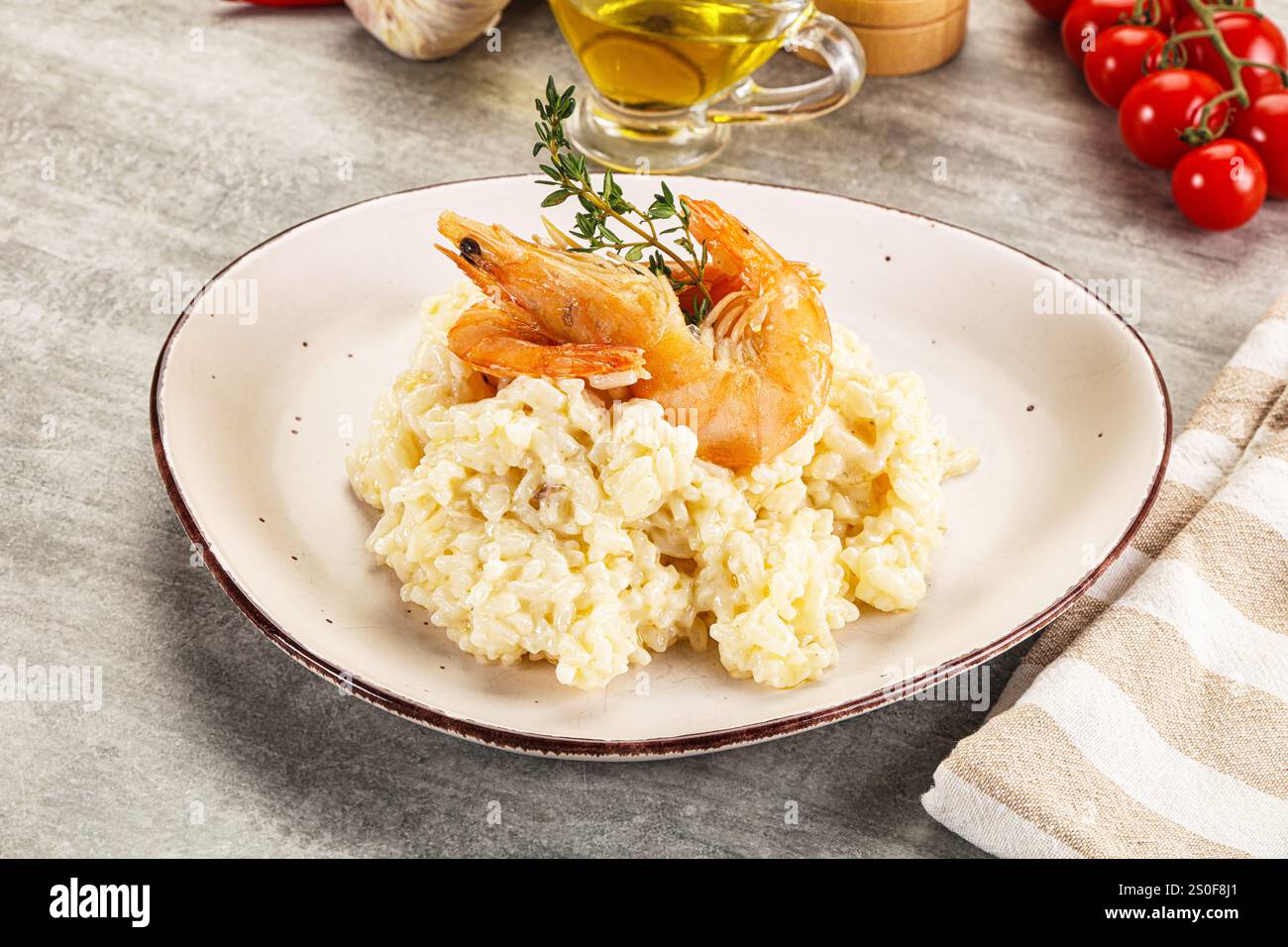 Italian cuisine - risotto with prawn served thyme Stock Photo - Alamy
