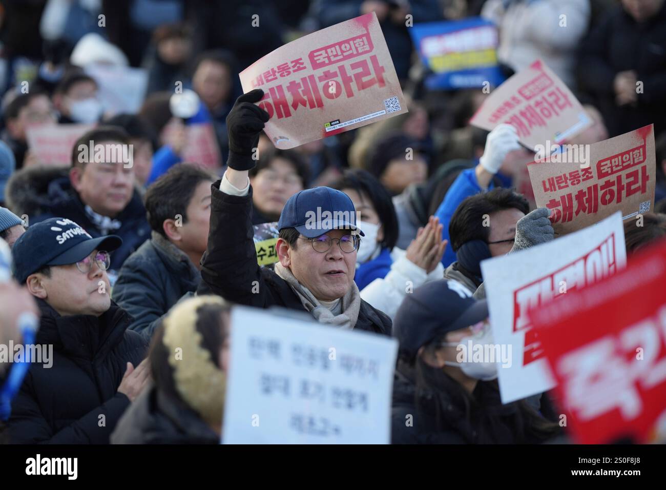South Korea's main opposition Democratic Party leader Lee Jae-myung holds a sign during a rally ...