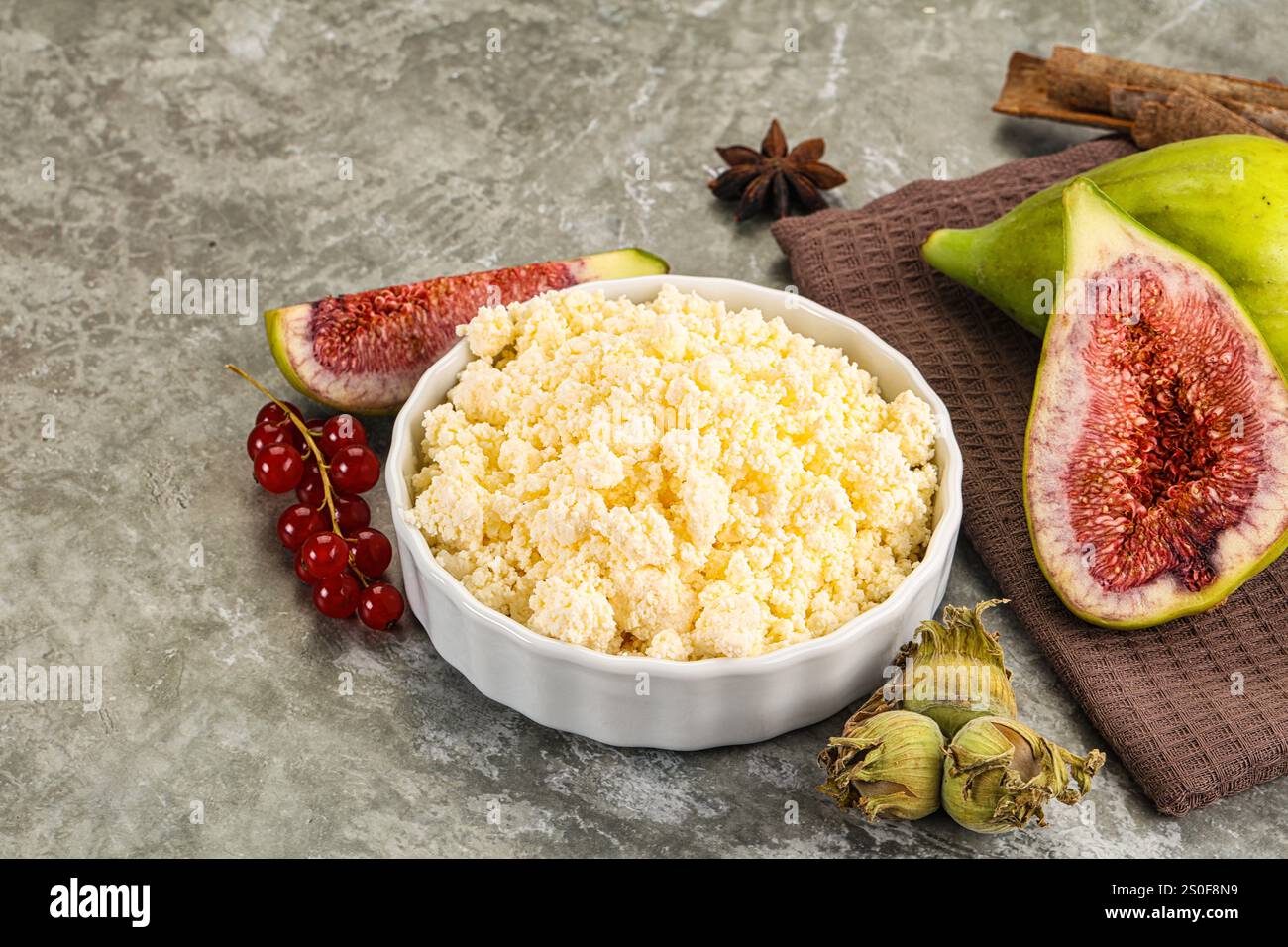Delicous sheep cottage cheese curd served fig Stock Photo - Alamy