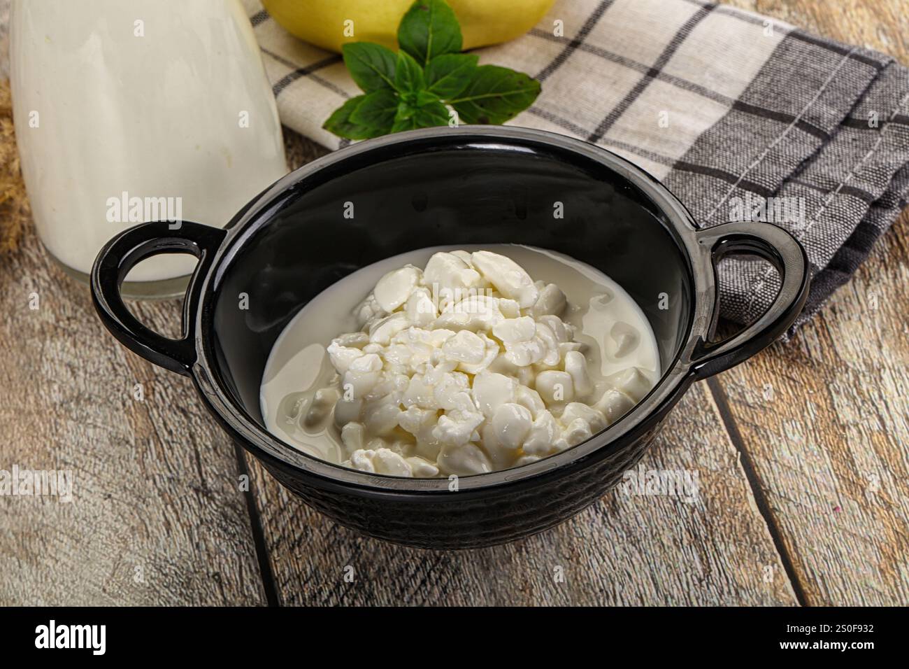Grain cottage cheese with sour in the bowl Stock Photo - Alamy