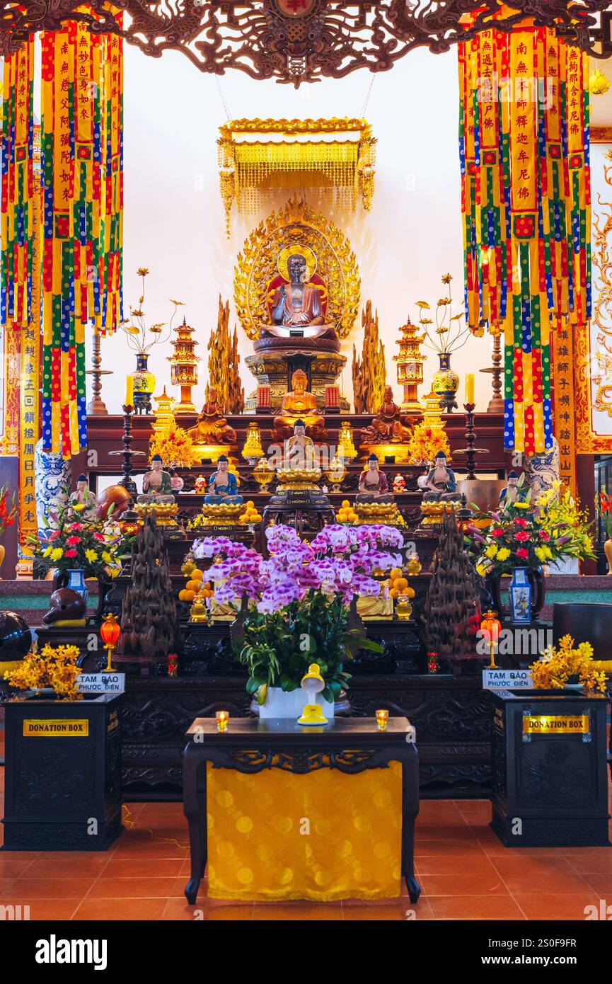 The interior and altar of a Buddhist temple in Asia, Vietnam, at the ...