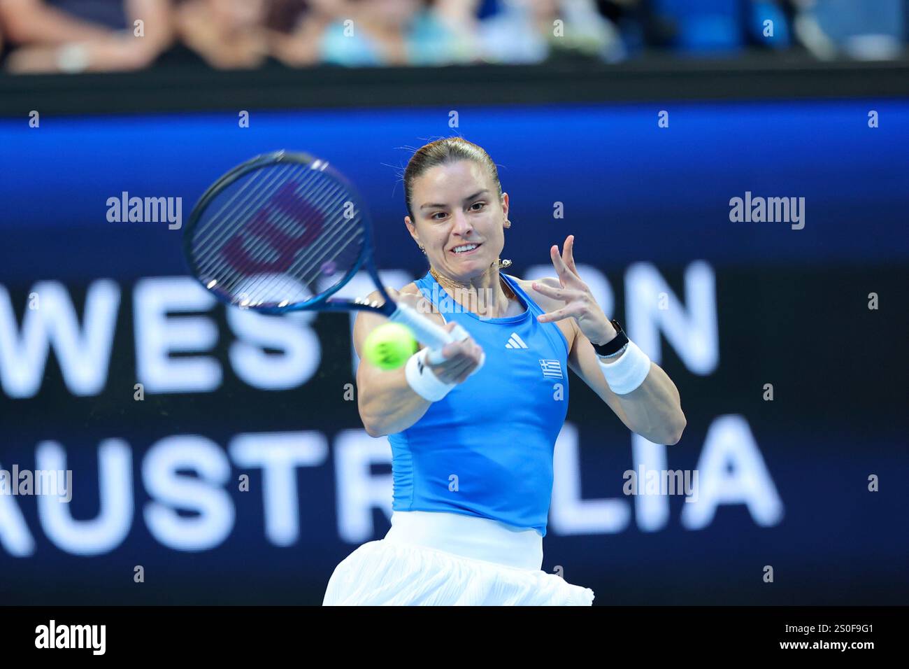 Maria Sakkari of Greece plays a forehand shot to opponent Jessica ...