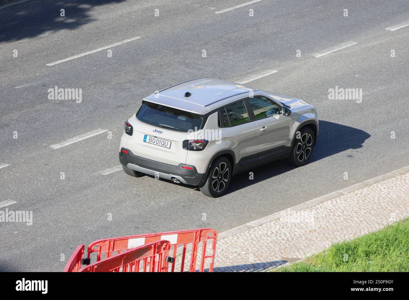 New generation jeep avenger car driving on asphalt road Stock Photo - Alamy