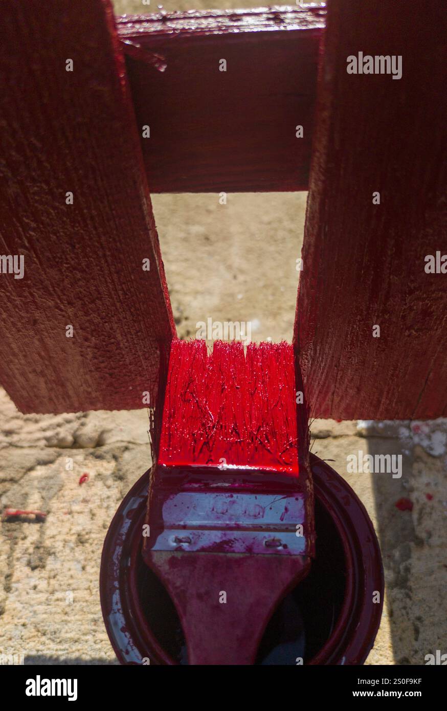 Flat brush beaver red impregnated resting over can. Painting a wooden ...