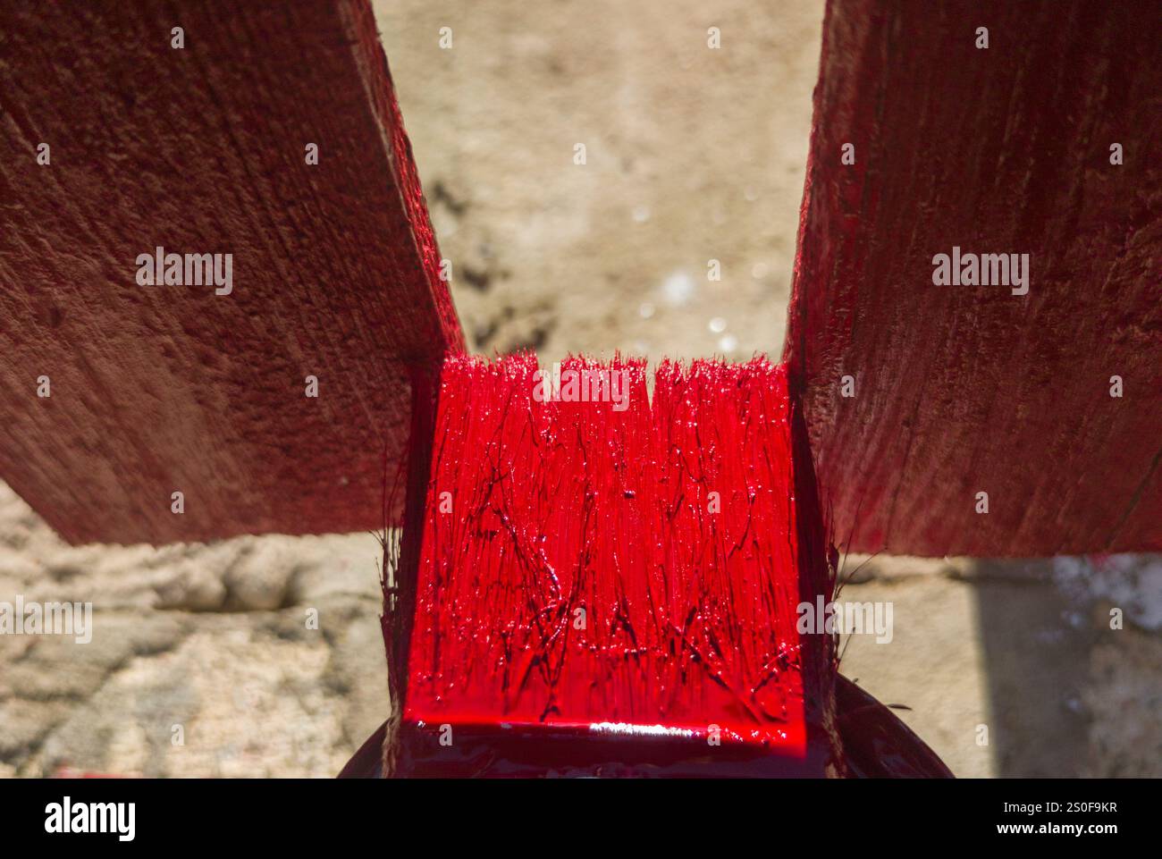 Flat brush beaver red impregnated resting over can. Painting a wooden ...