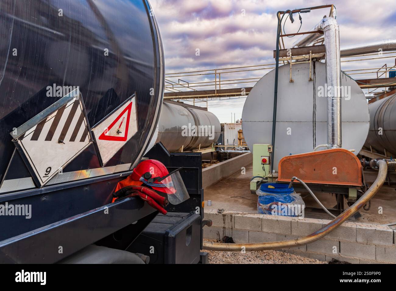 High-temperature hazard labels on an asphalt bitumen tanker truck ...