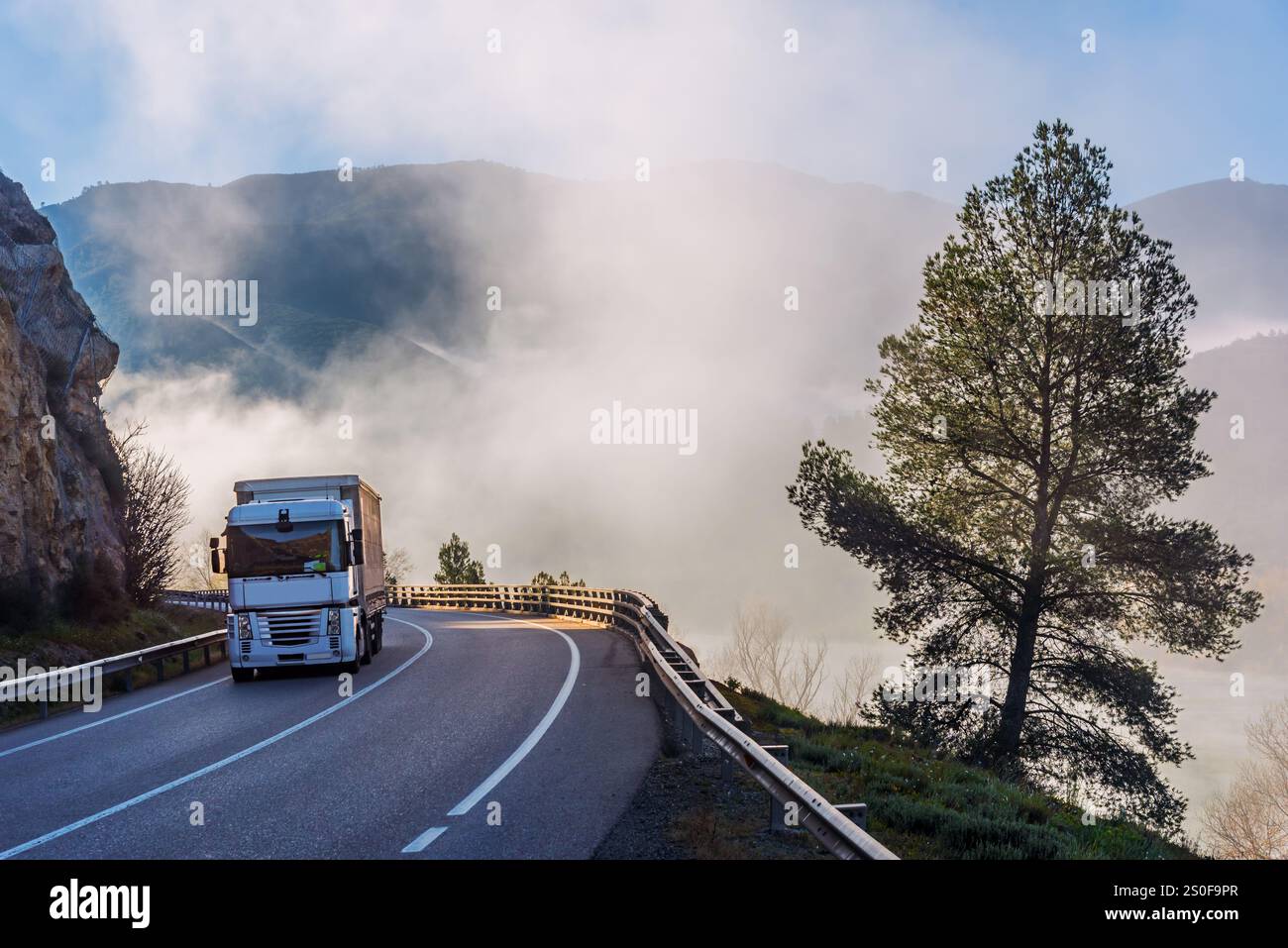 Road next to cliff fog hi-res stock photography and images - Alamy