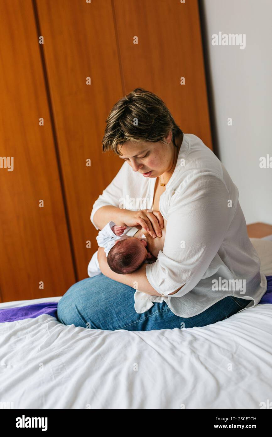 On bed breastfeeding hi-res stock photography and images - Alamy
