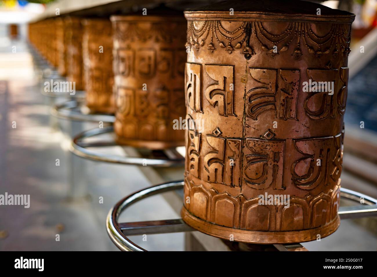 Traditional Tibetan prayer wheel with intricate golden design and ...