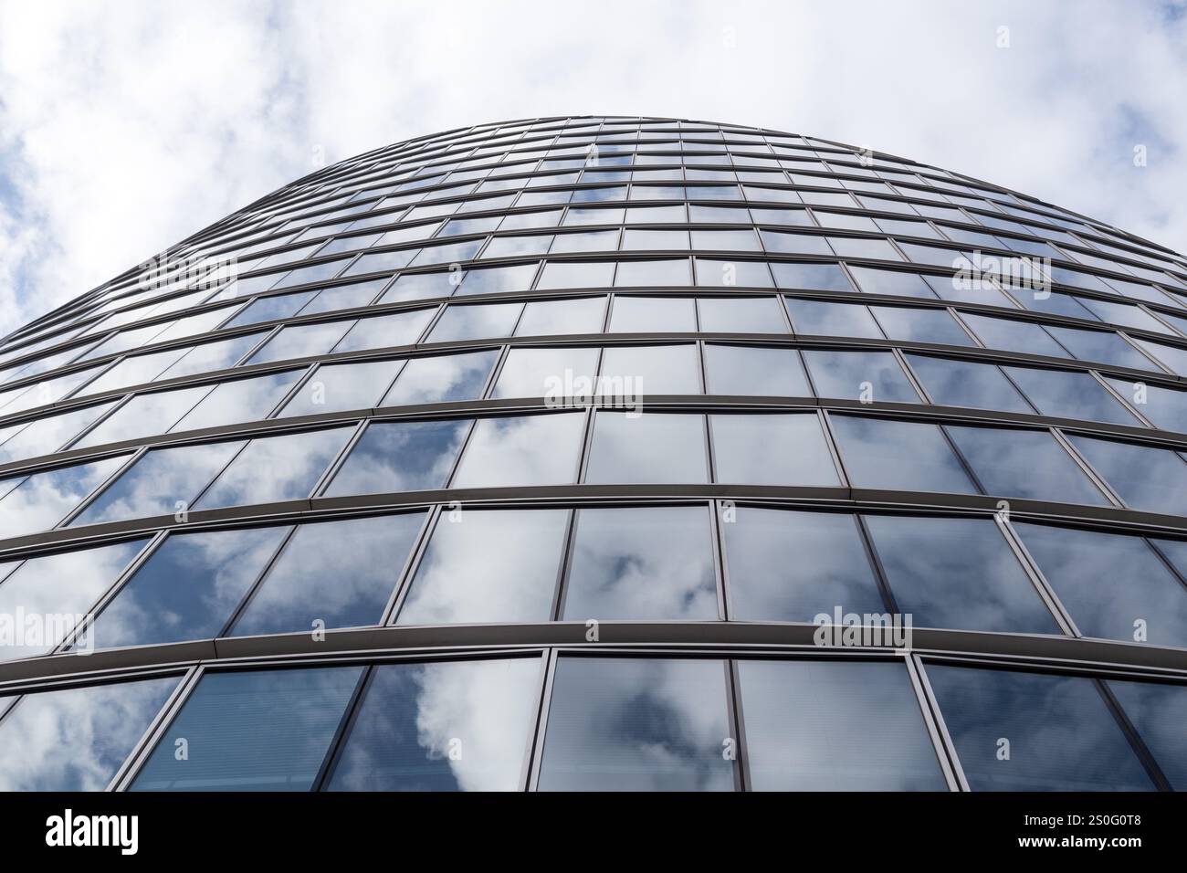 Modern Glass Facade Reflecting the Sky: Abstract Urban Architecture, A close-up view of a curved ...