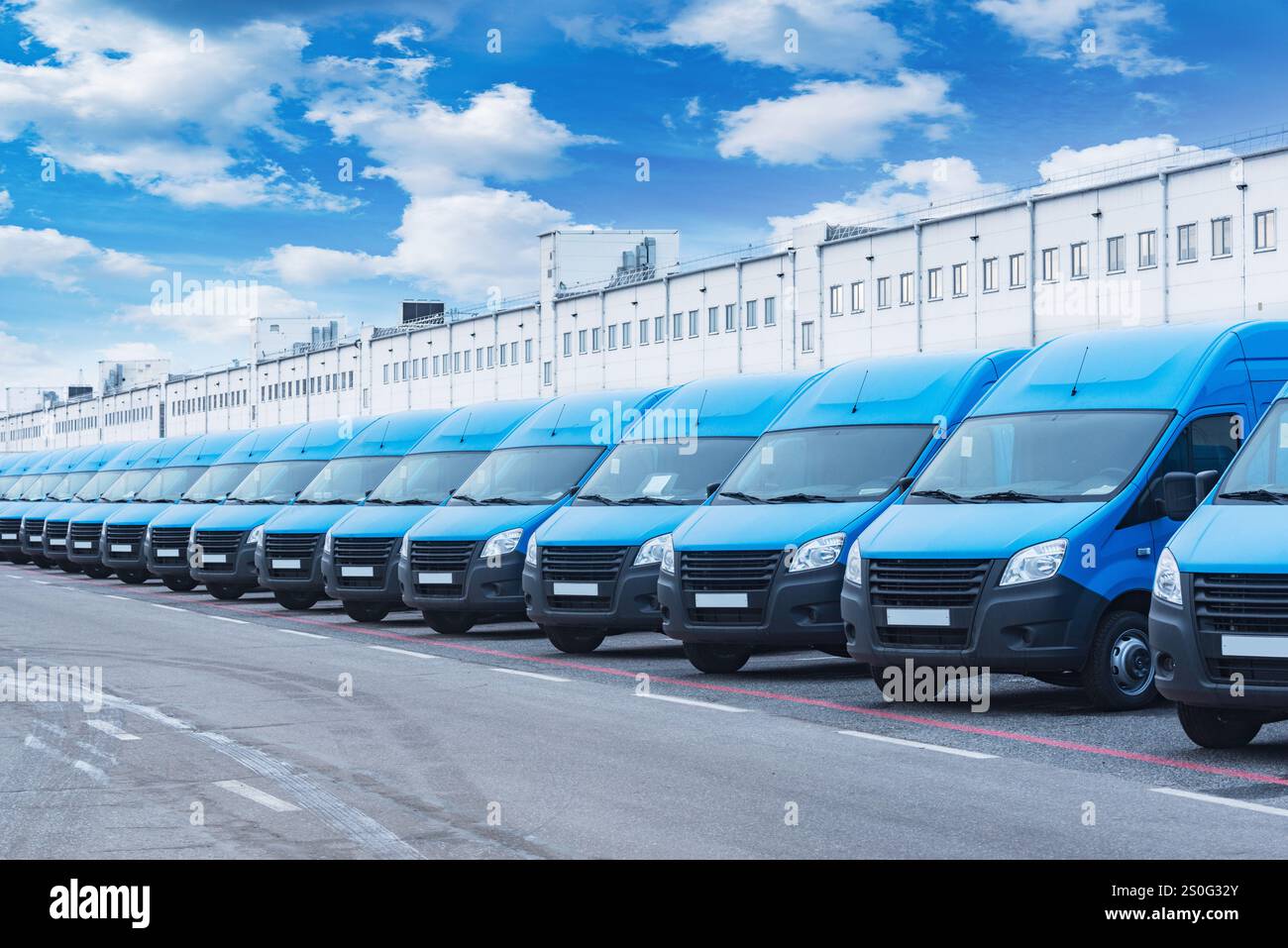 Freight trucks stand by the storage building Stock Photo - Alamy