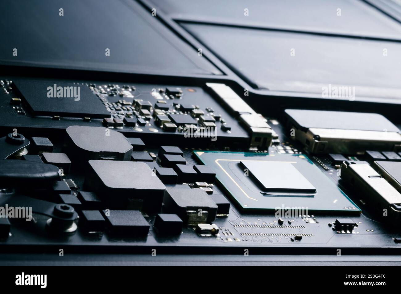 Close-up part of motherboard from laptop computer show up a CPU and other components on board ...