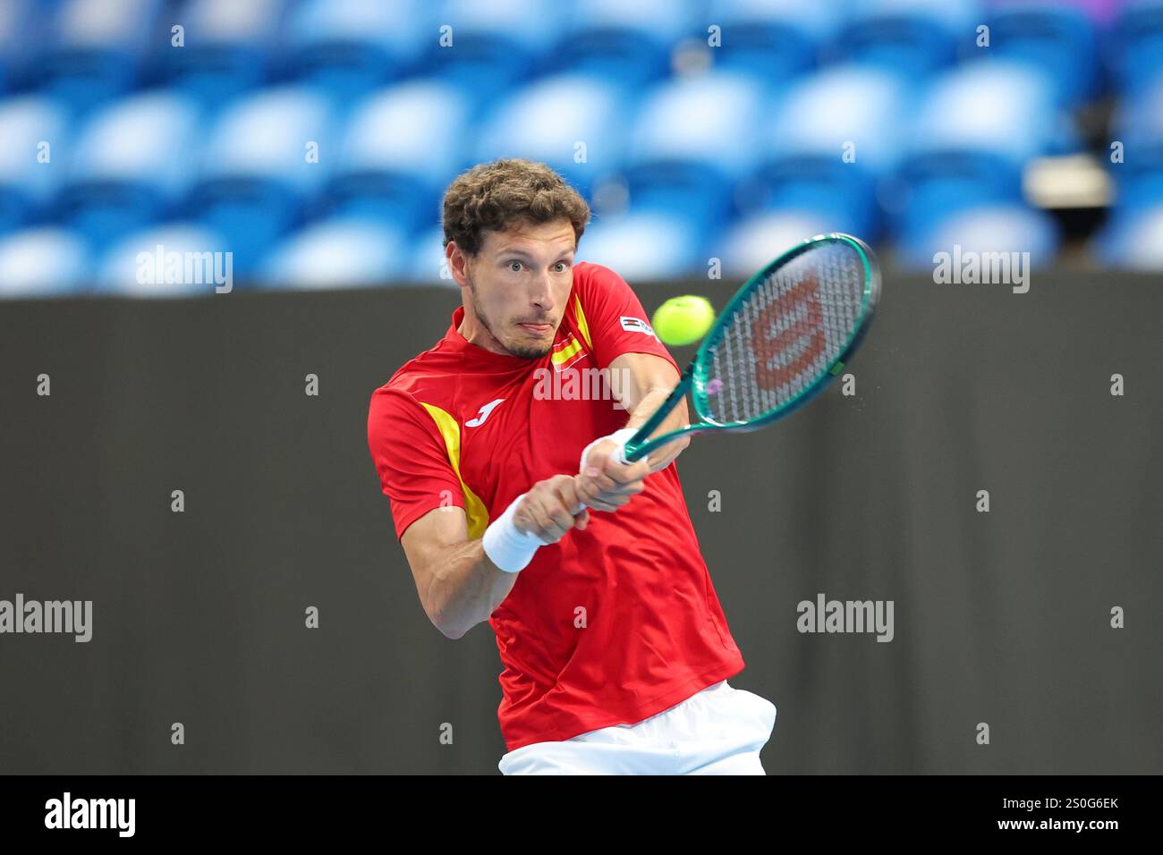 Pablo Carreno Busta of Spain returns a shot to Stefanos Tsitsipas of ...