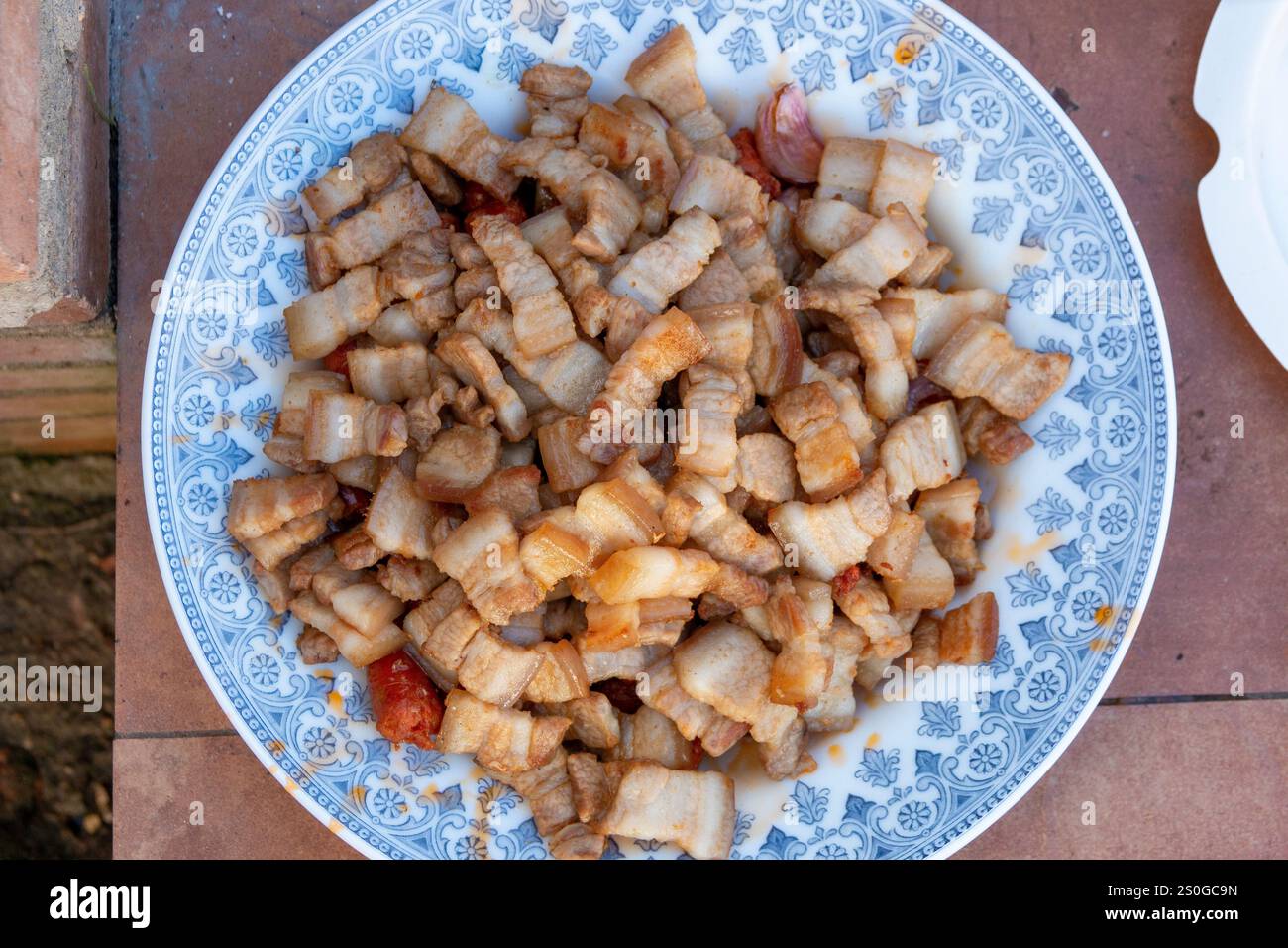 Preparing La Mancha or Castilian migas as a family where everyone eats ...
