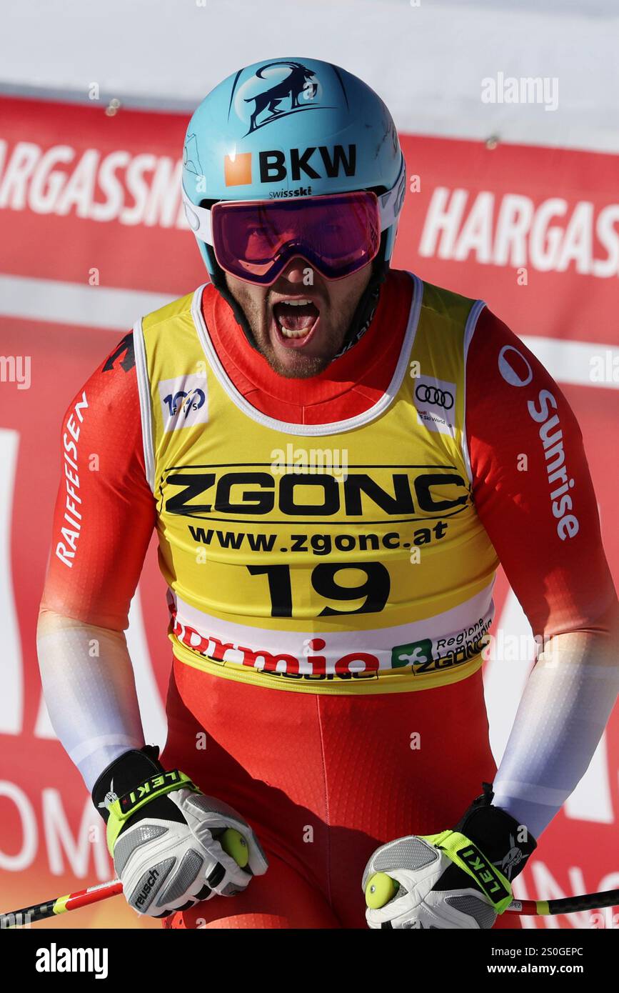 Switzerland's Alexis Monney reacts after completing an alpine ski, men ...