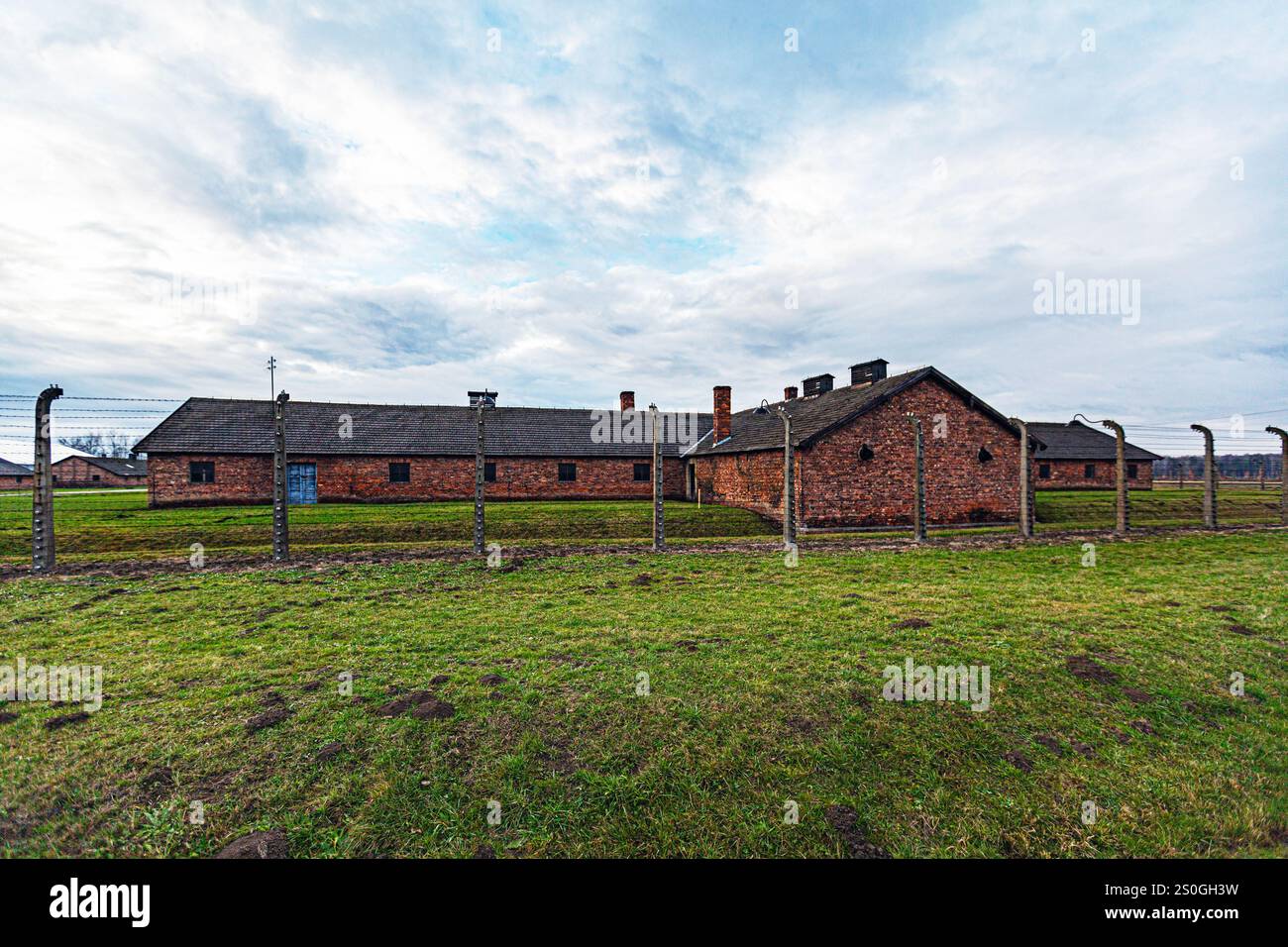 Brick Barracks Enclosed by Fences at Auschwitz-Birkenau Stock Photo - Alamy