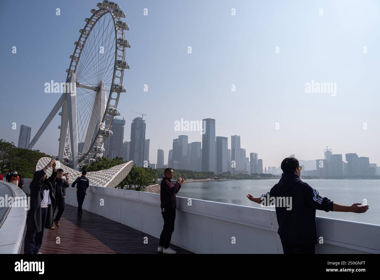 Shenzhen, China. 28th Dec, 2024. Tourists seen take a photo of the ...