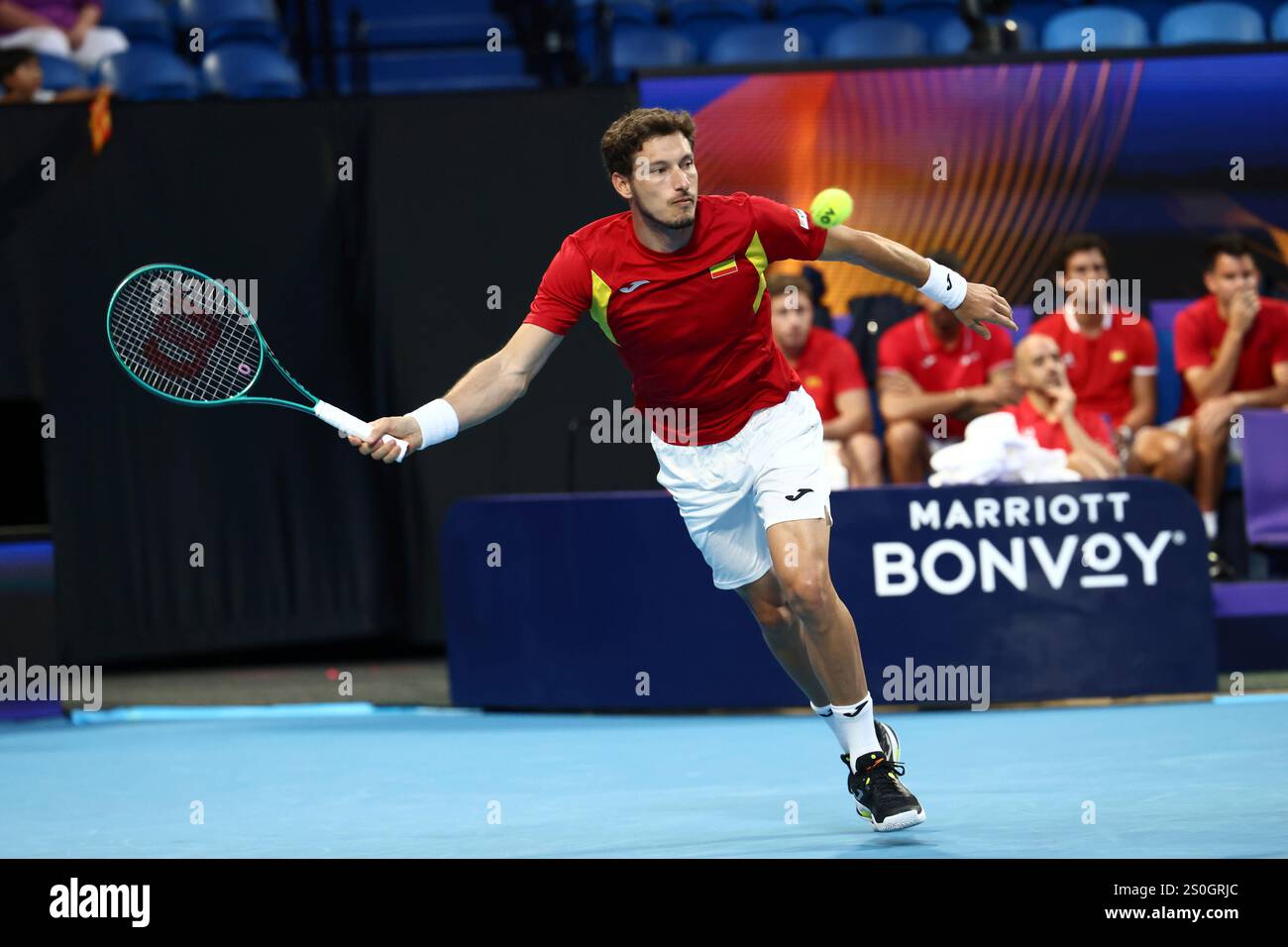 Pablo Carreno Busta of Spain hits a return shot to Stefanos Tsitsipas ...