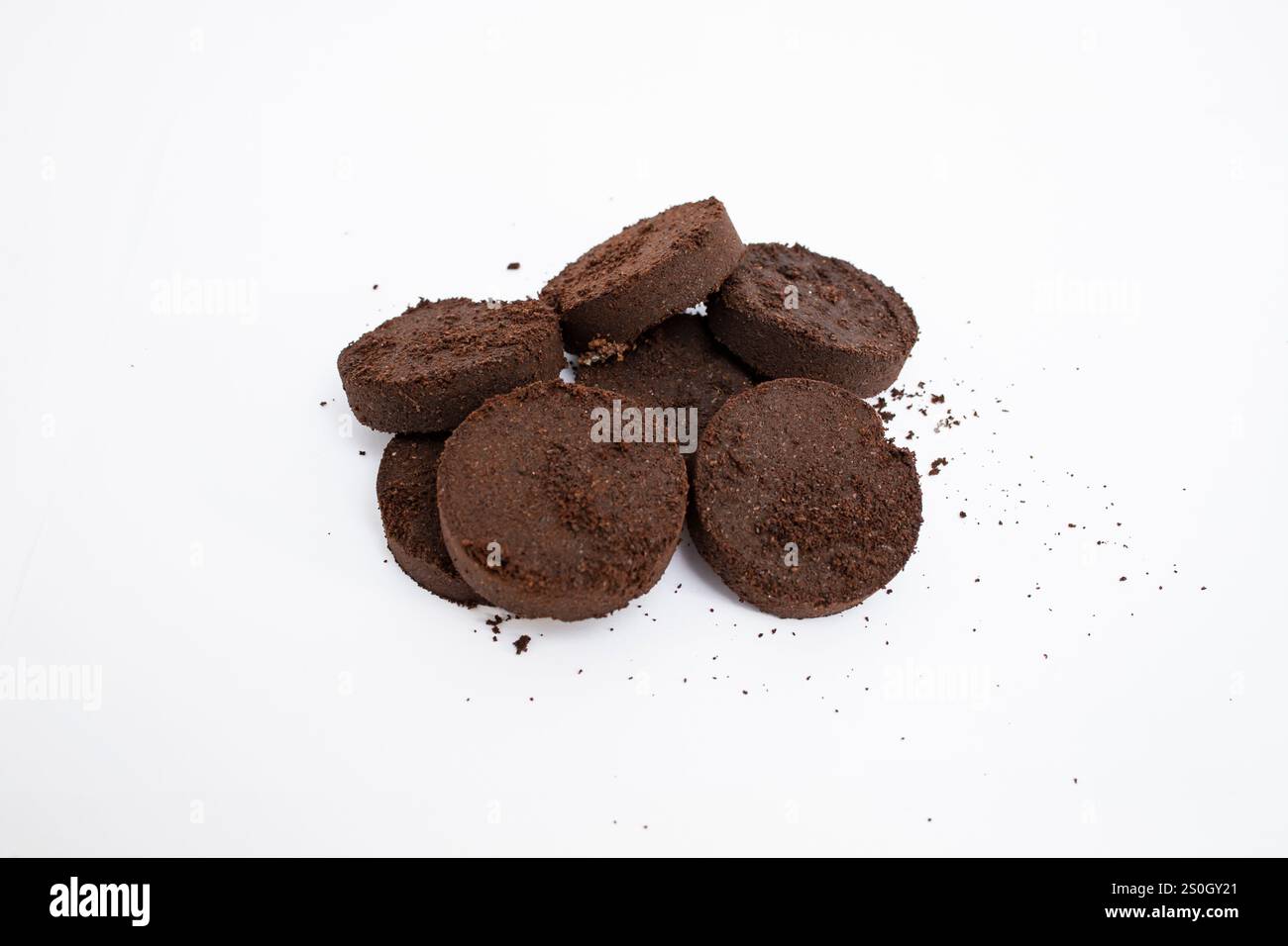 Dry coffee puck from espresso machine, isolated on white background ...