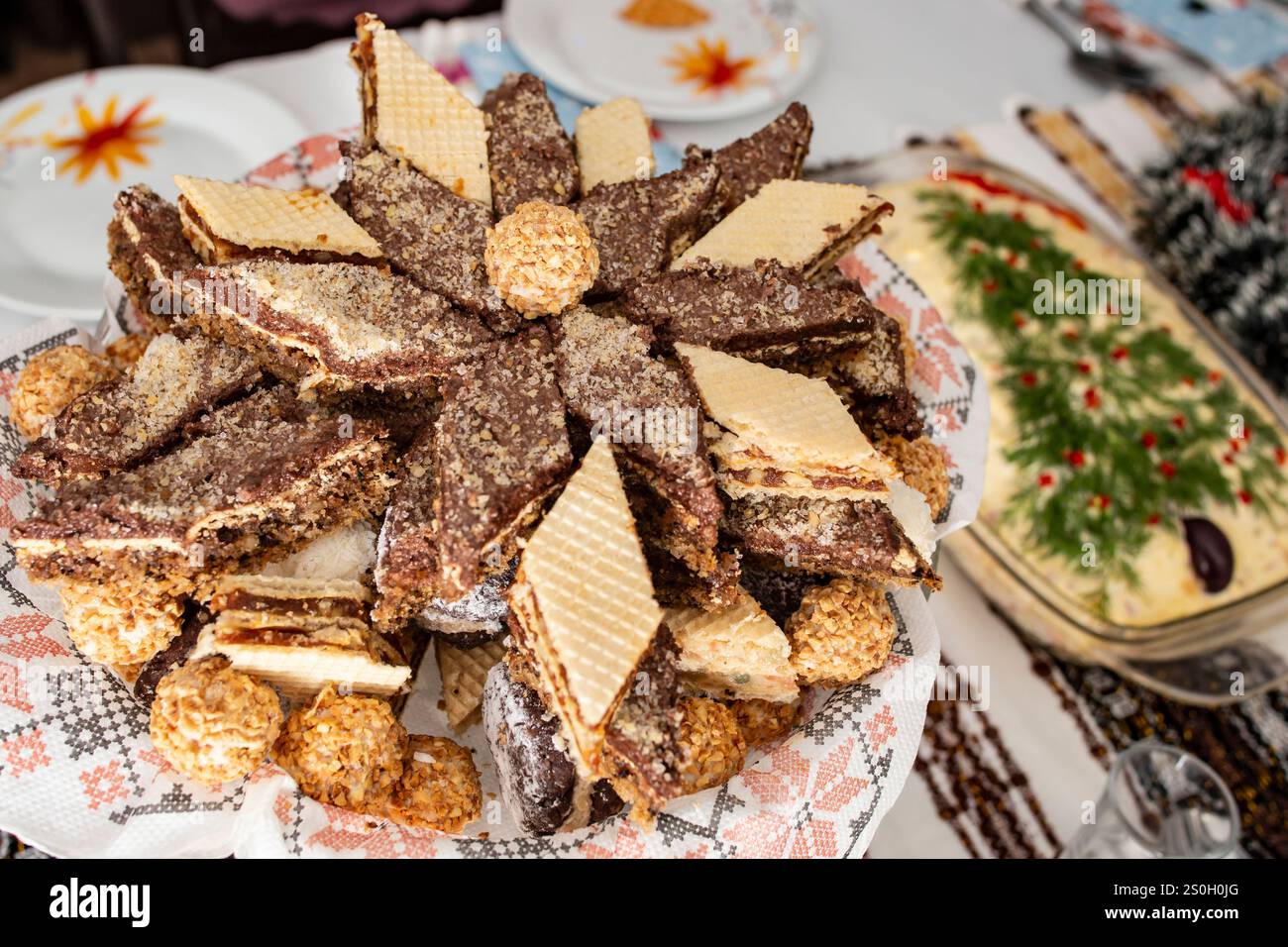 Baked diamond shaped cookies stacked and served on christmas dinner ...