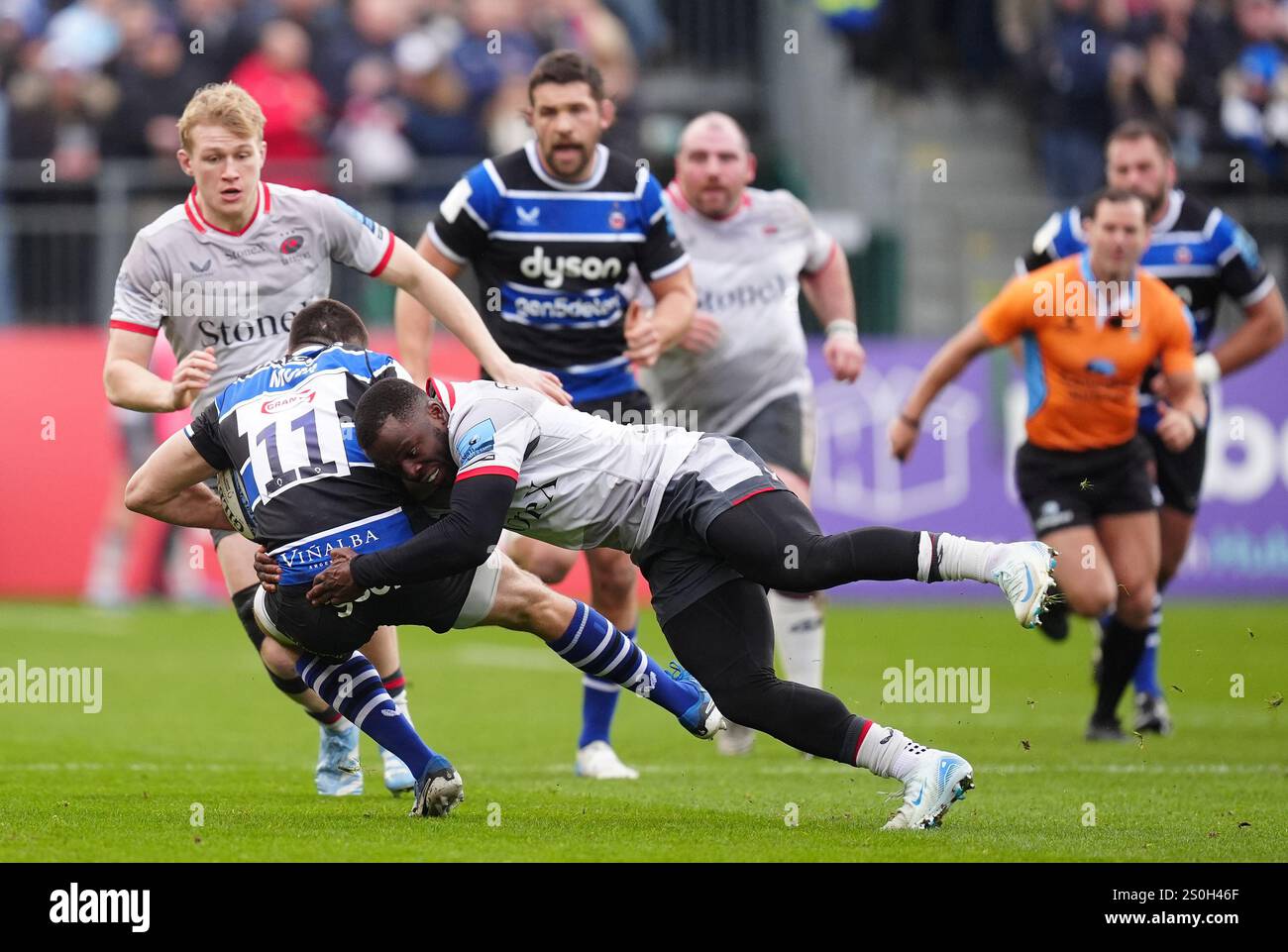 Bath's Will Muir is tackled by Saracens' Rotimi Segun during the ...