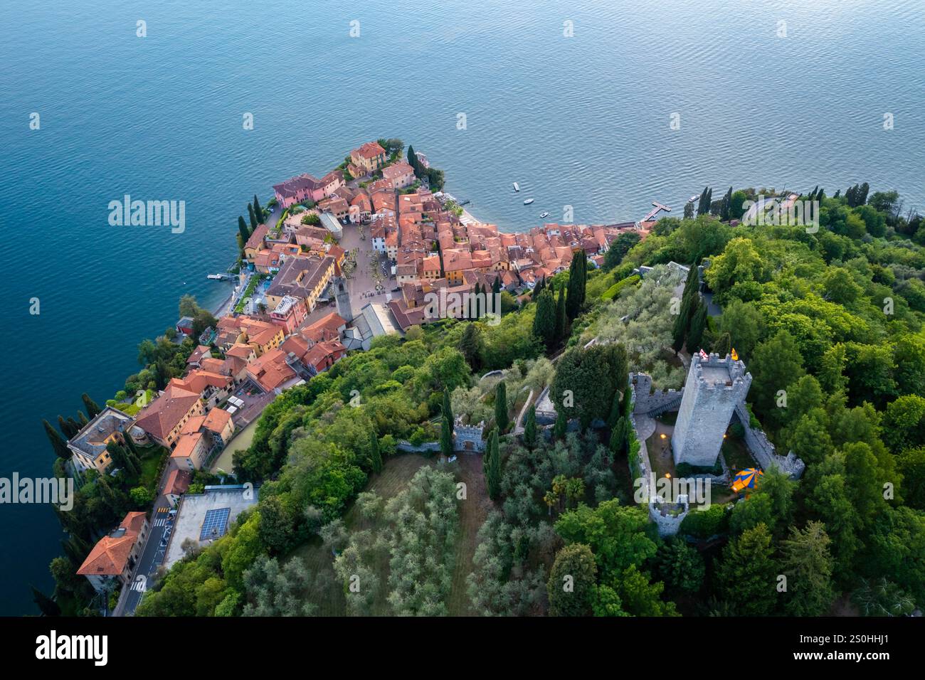 Aerial view of the castle of Vezio, dominating lake Como and Varenna ...