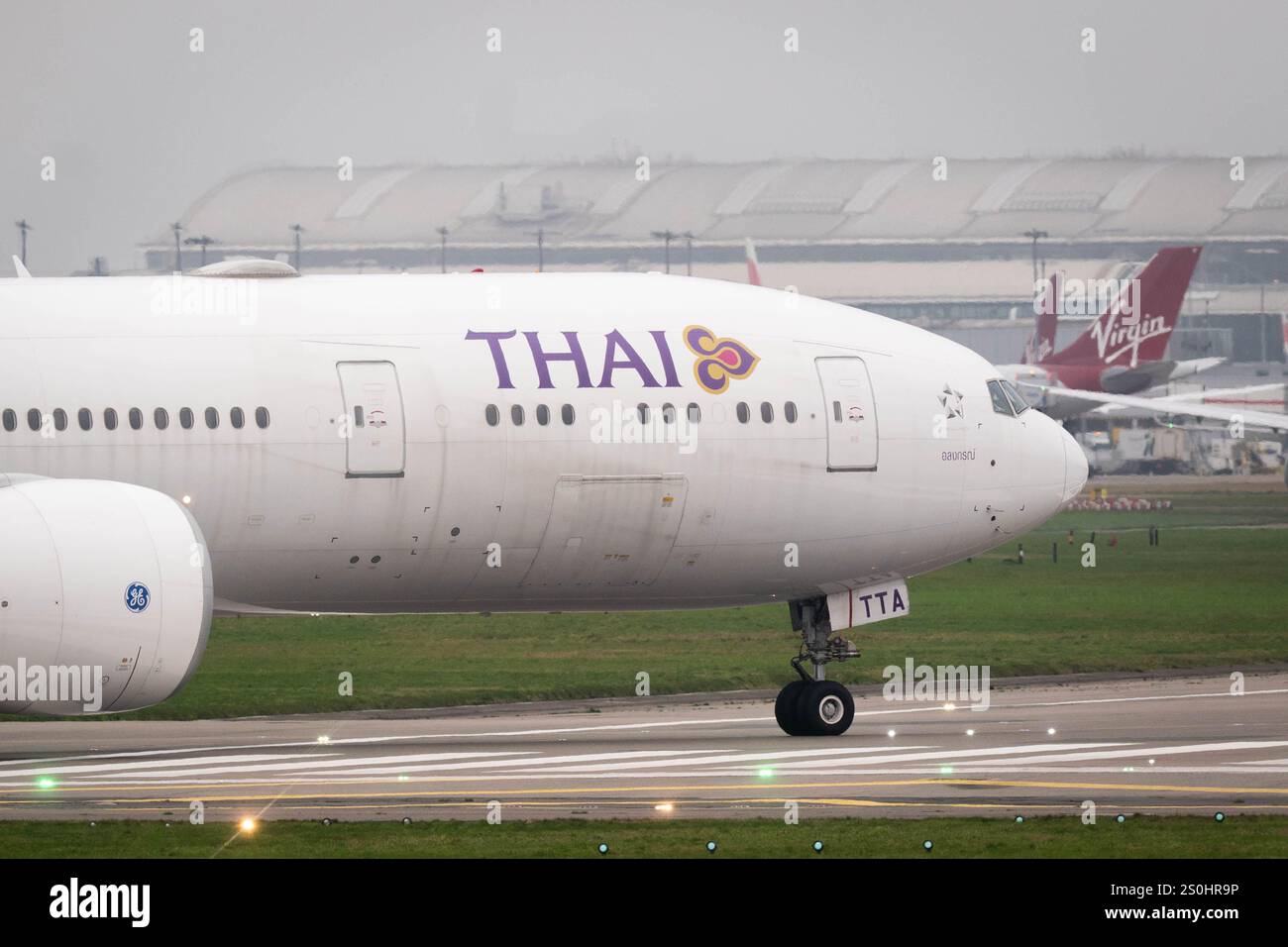 A Thai Airways Boeing B777-300ER on runway 27R at Heathrow Airport ...