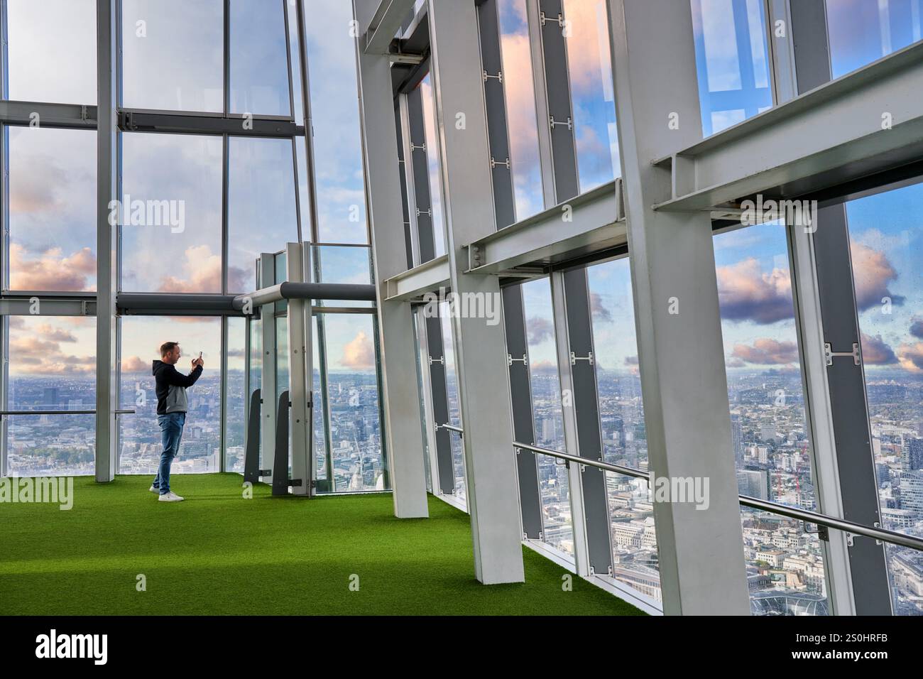 Man looking at the city, Views from The Shard, London, England, UK ...