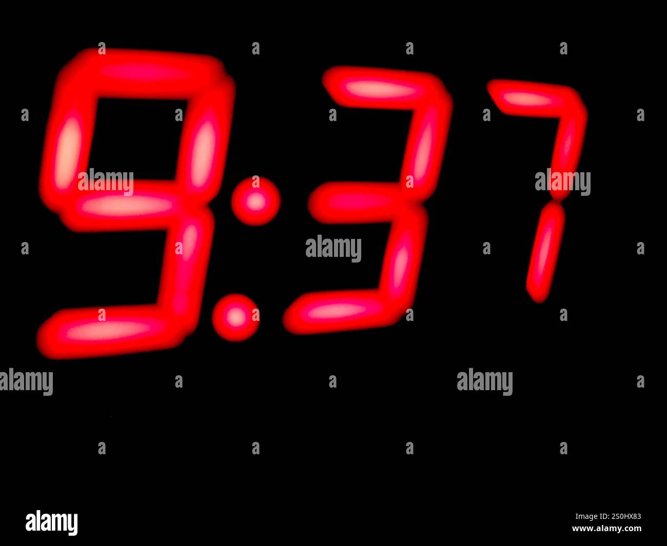A digital clock face showing the time in red numbers on a black ...