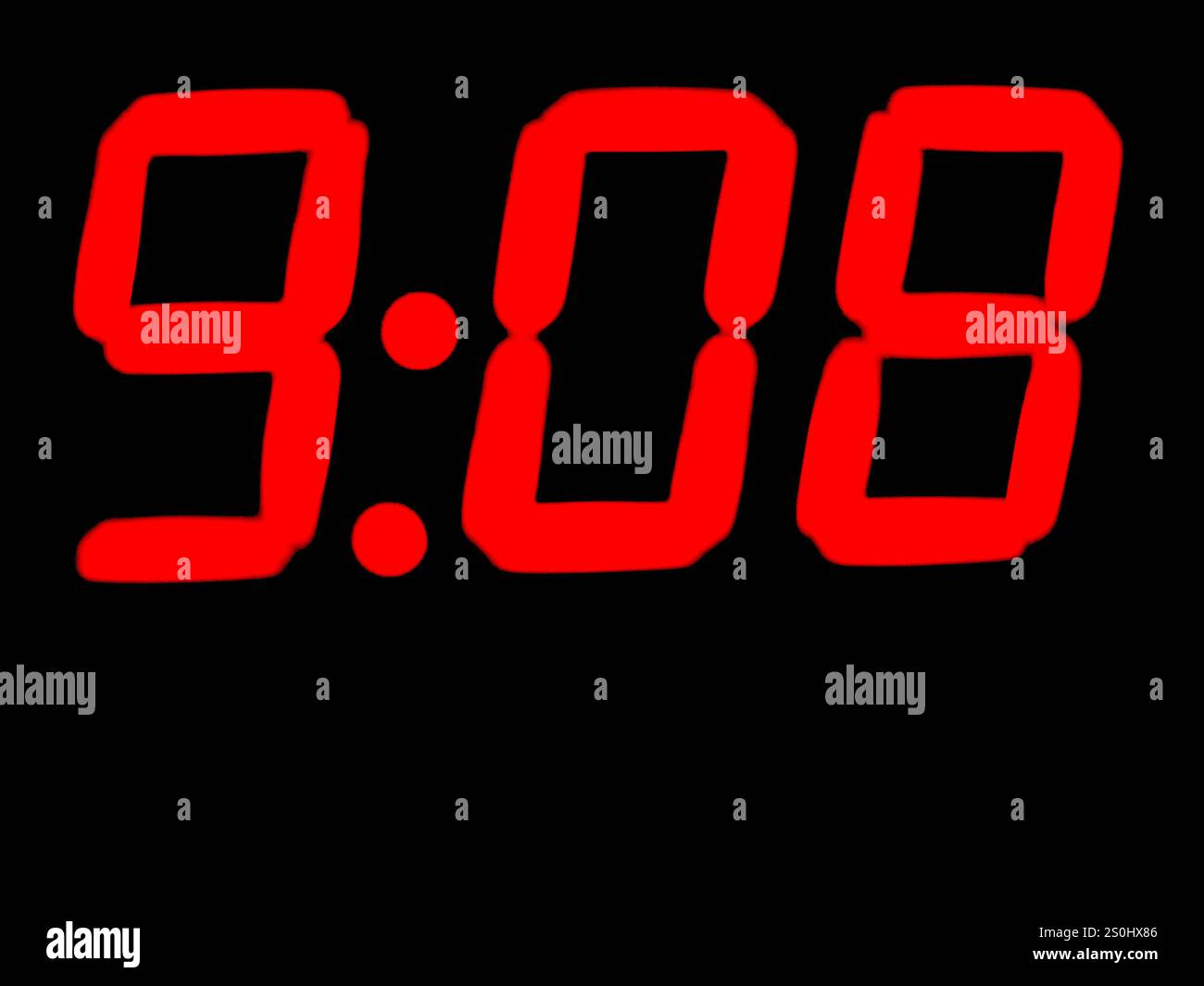 A digital clock face showing the time in red numbers on a black ...