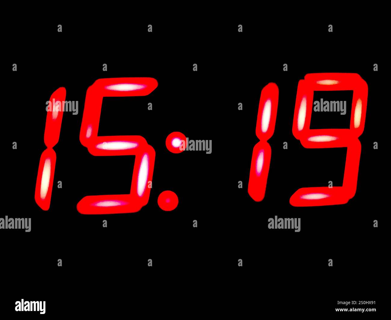 A digital clock face showing the time in red numbers on a black ...