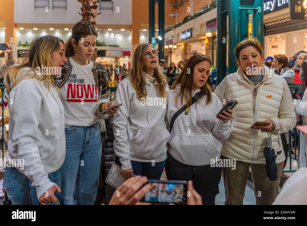 Haifa, Israel - December 27, 2024: People dressed in white and hostage ...
