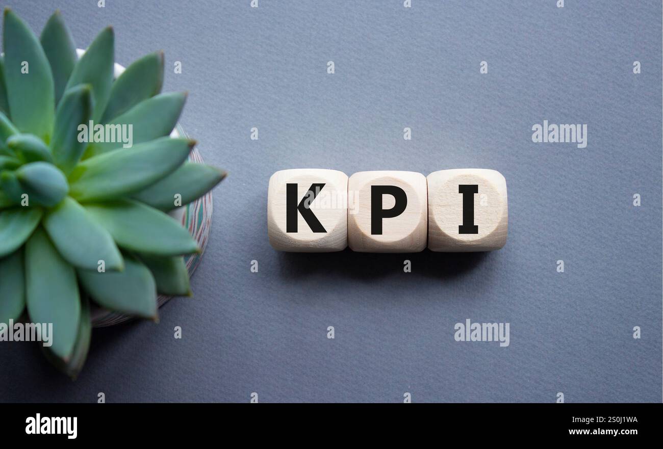 KPI- Key Performance Indicator. Wooden cubes with word KPI. Beautiful ...