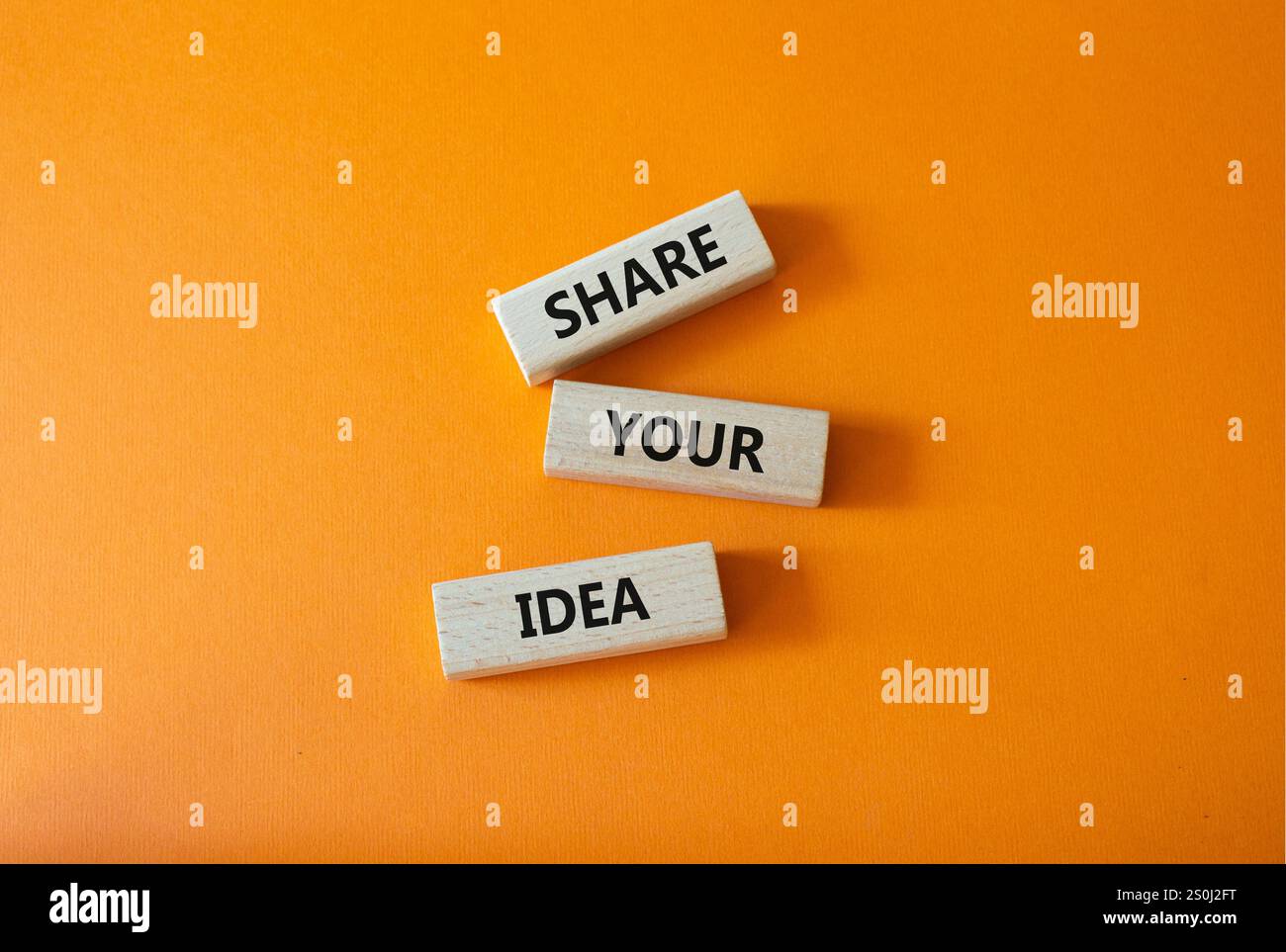 Share your Idea symbol. Concept words Share your Idea on wooden blocks. Beautiful orange ...