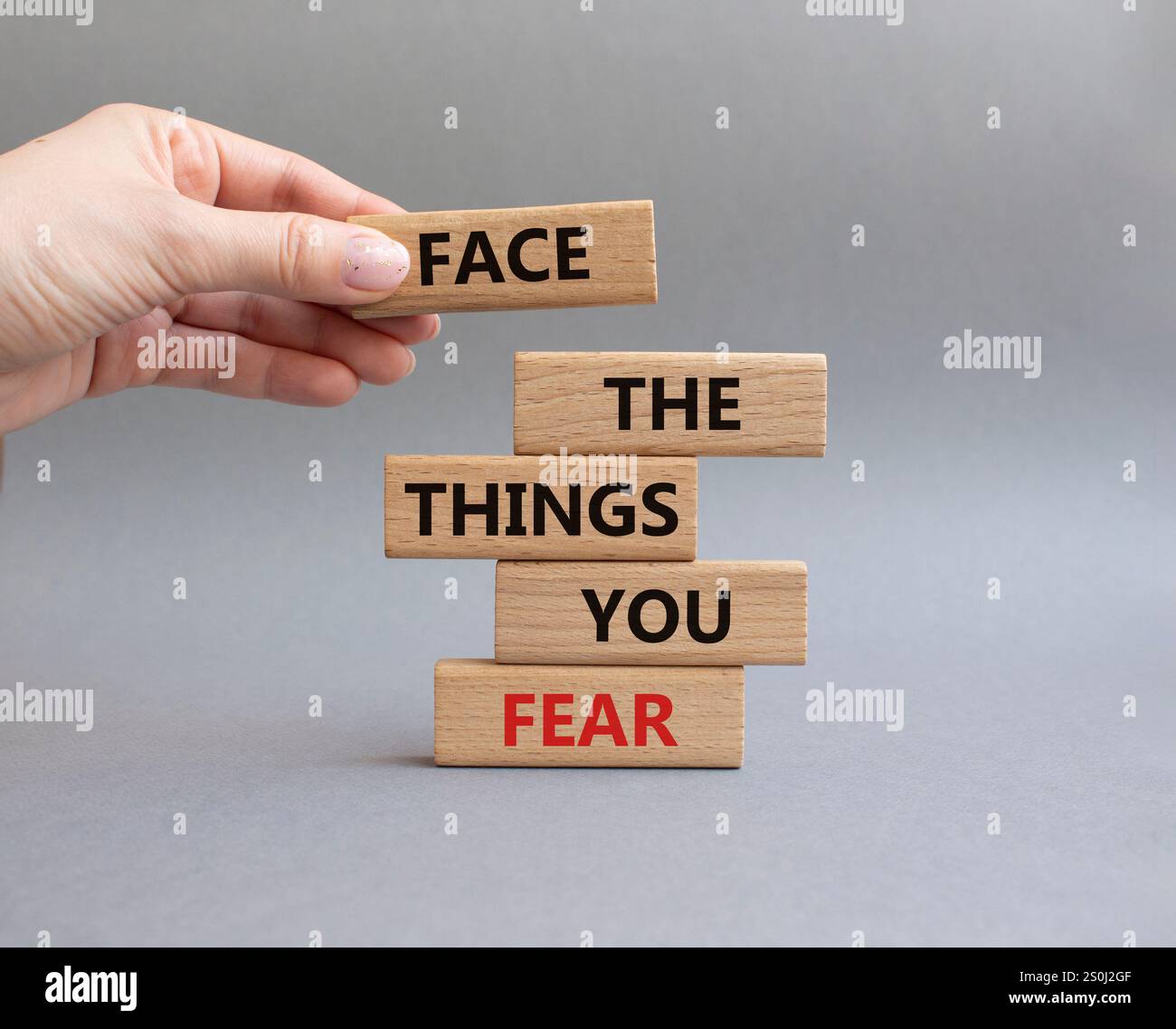 Face the things you fear symbol. Wooden blocks with words Face the ...