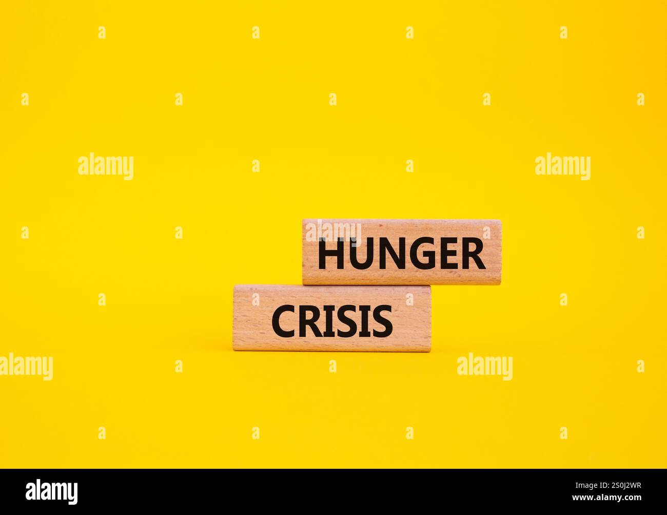 Hunger Crisis symbol. Wooden blocks with words Hunger Crisis. Beautiful ...