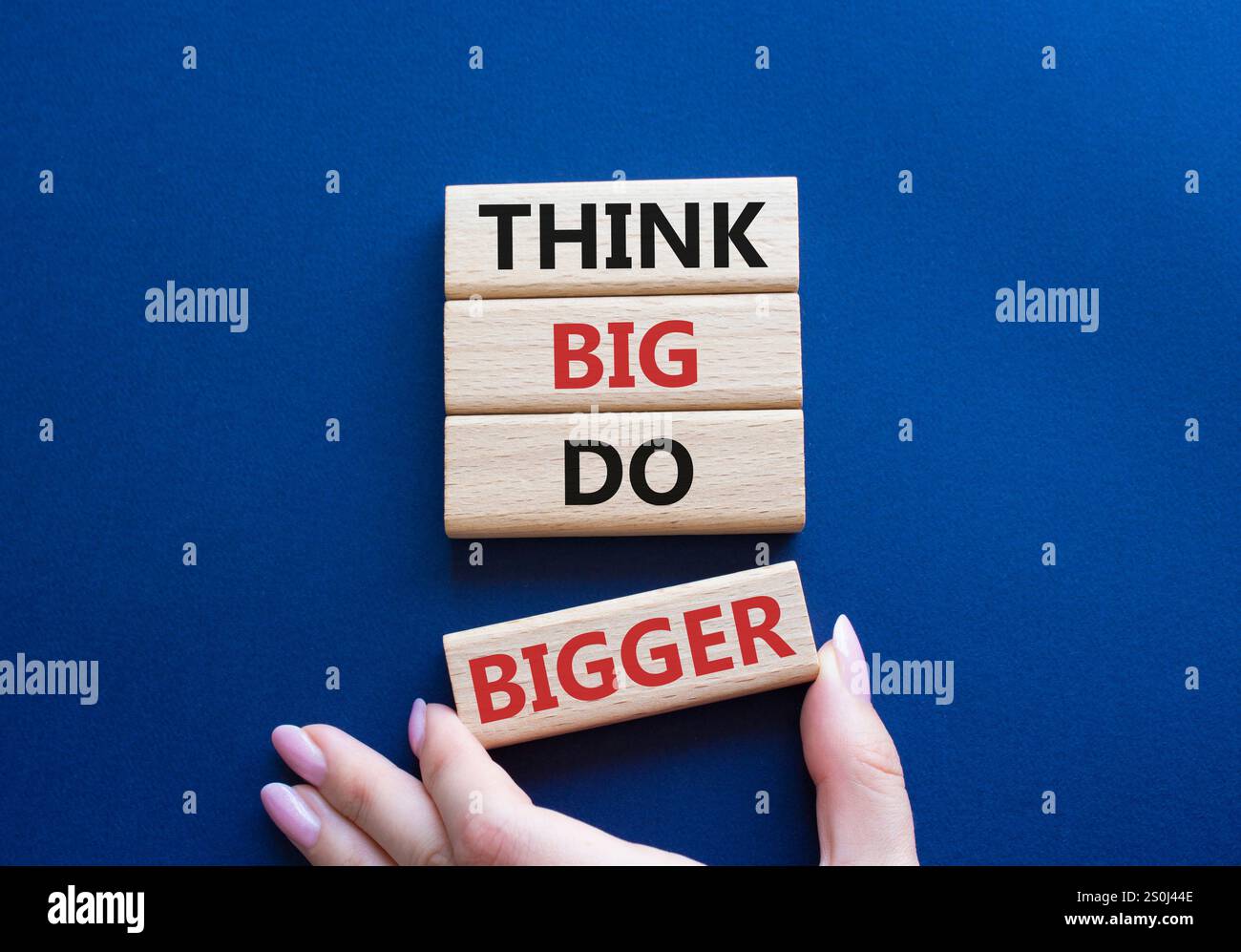 Think Big Do Bigger symbol. Wooden blocks with words Think Big Do ...